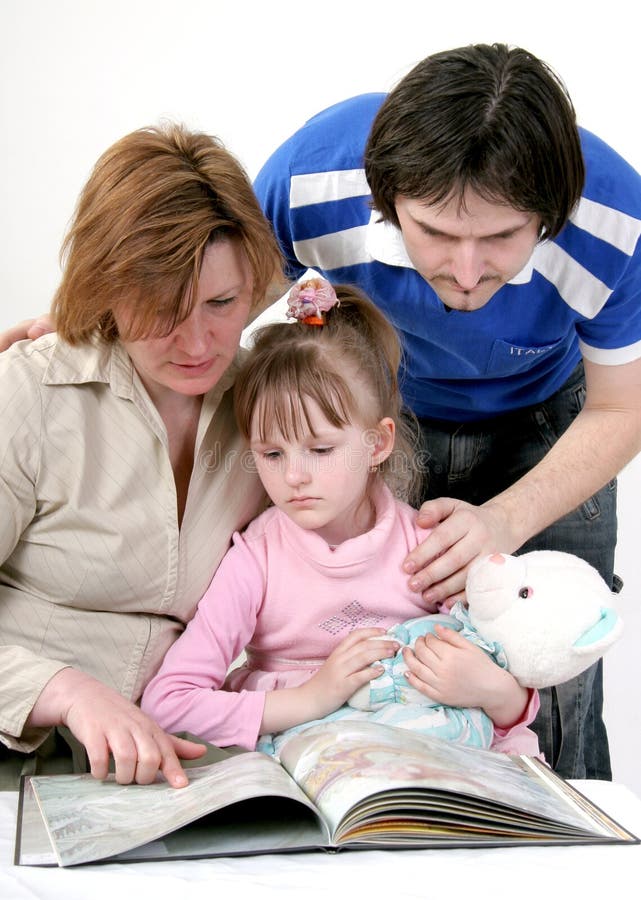Family read the book stock image. Image of home, happy - 5169901