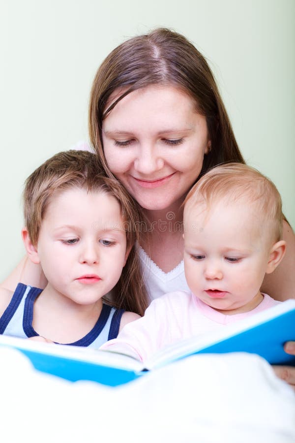 Family Reading Book To Baby Stock Image - Image of smile, happy: 13151685