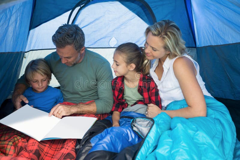 Family Reading Book in the Tent Stock Image - Image of people, girl ...