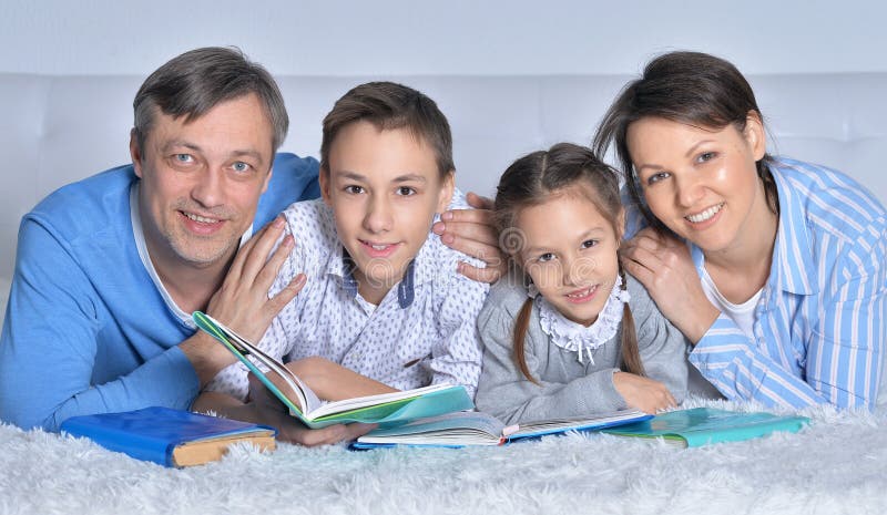 Family reading books stock photo. Image of father, loving - 87652670