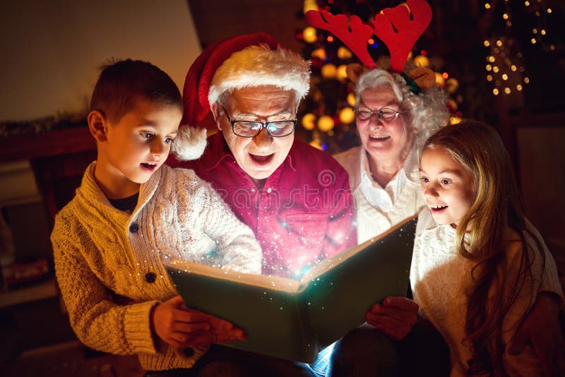 Family Reading Christmas Magic Book Stock Photo - Image of happy ...
