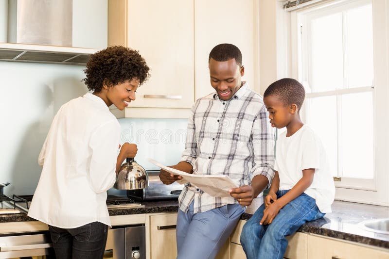 Family Reading in the Kitchen Stock Image - Image of counter, family ...