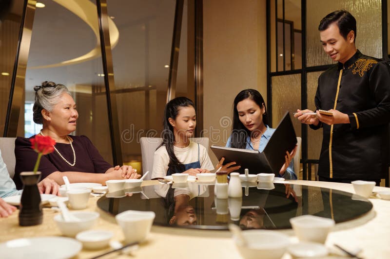 Family Reading Menu and Making Order Stock Image - Image of child ...