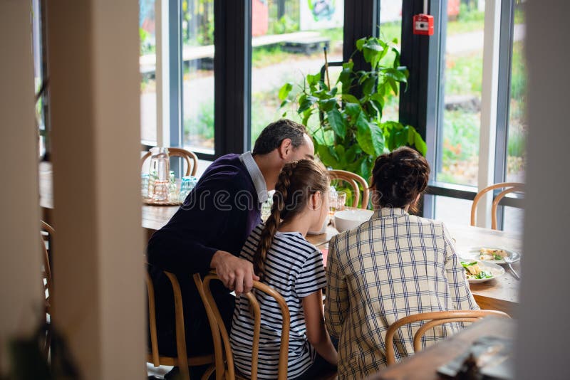 A Family Reading Something at the Kitchen Table, View from the B Stock ...