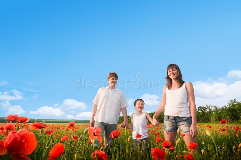 Family in red poppy field stock image. Image of outside - 23128267