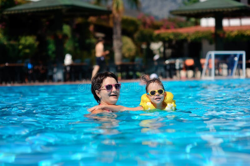 Family rest in pool stock photo. Image of parent, child - 28645030