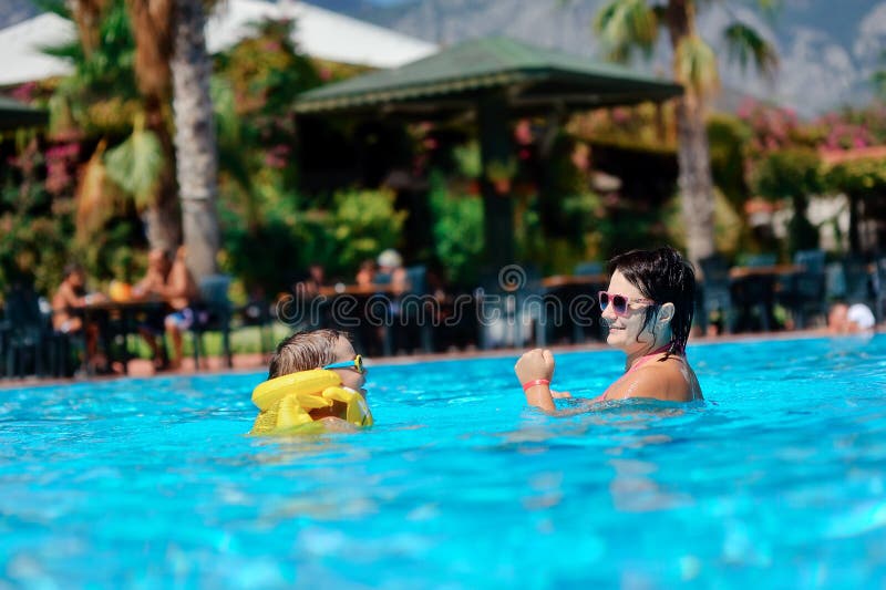 Family rest in pool stock image. Image of relaxation - 28645149
