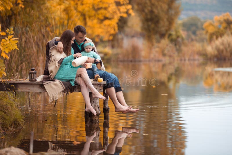 Family resting on the lake stock photo. Image of leisure - 61936698