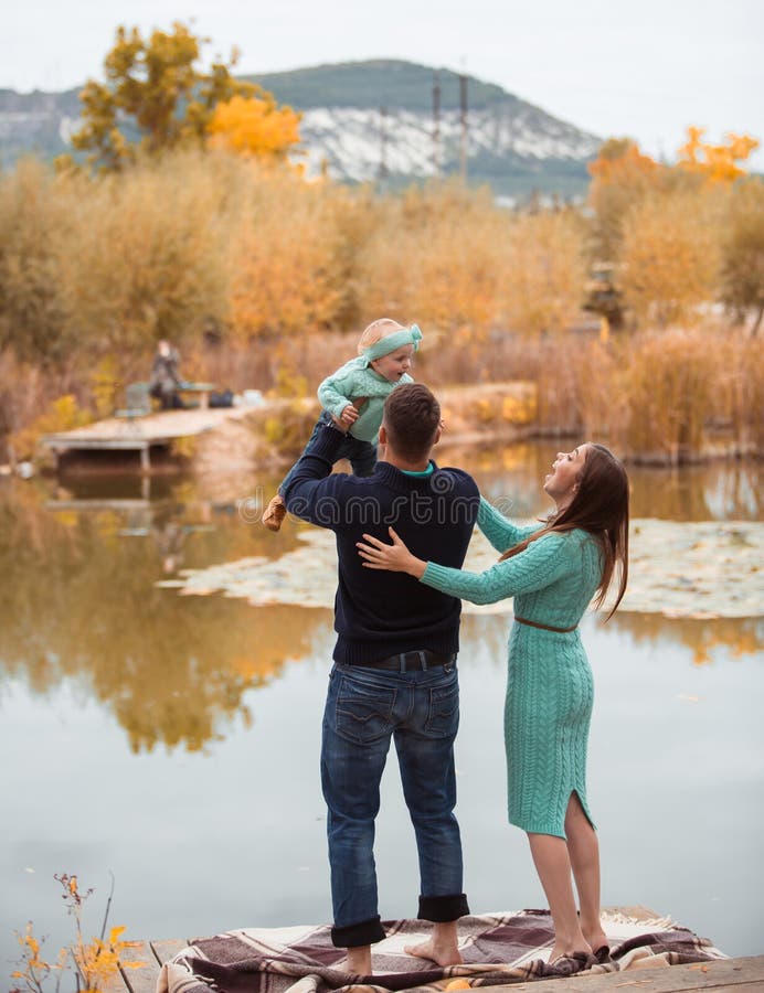 Family resting on the lake stock image. Image of outdoors - 61936731