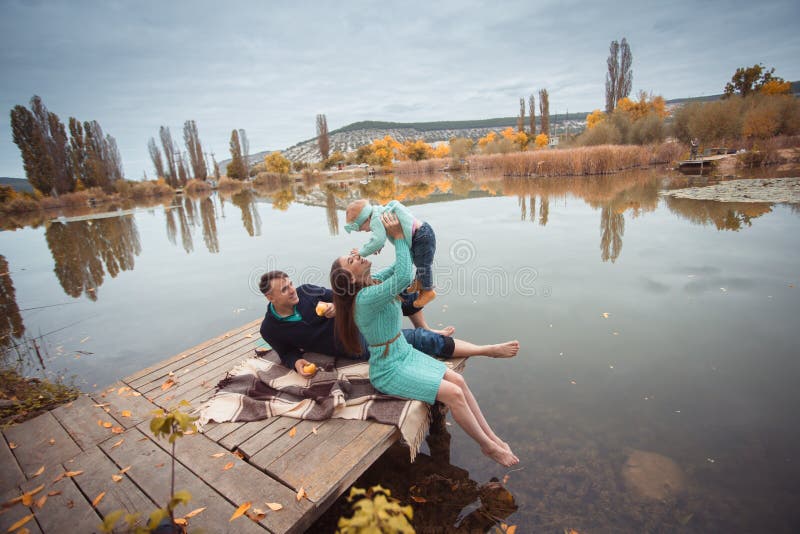 Family resting on the lake stock photo. Image of caucasian - 61936744