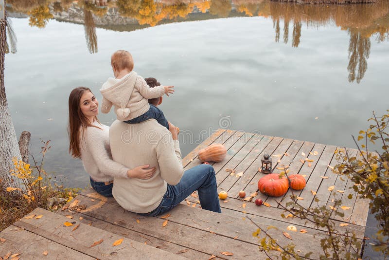 Family resting on the lake stock photo. Image of nature - 61936876