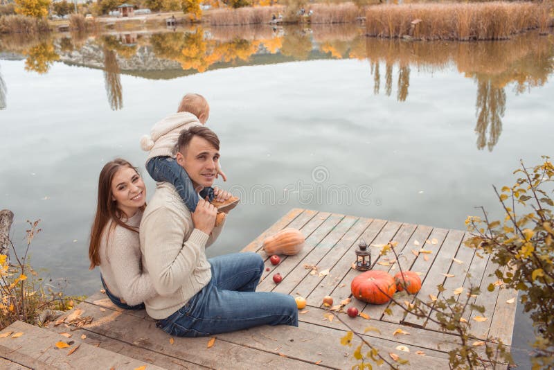 Family resting on the lake stock image. Image of holiday - 61936699