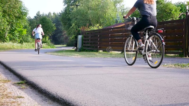 Family Riding Mountain Bikes through a Forest Cycle Stock Footage ...