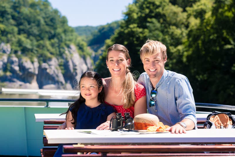 Family on River Cruise Looking at Mountains from Ship Deck Stock Photo ...