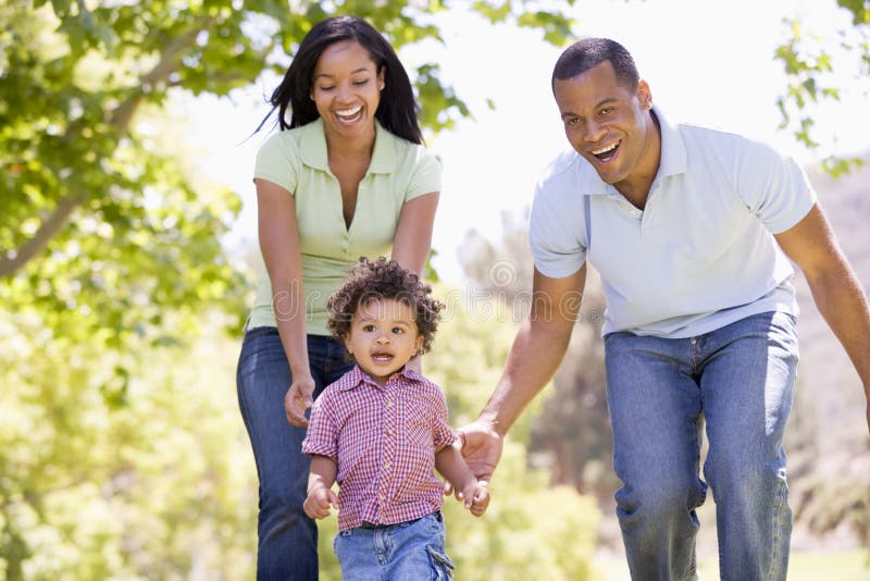 Family Running Outdoors Smiling Stock Photo - Image of running, playing ...