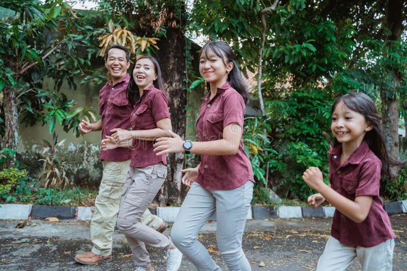 Family Running Outdoors Smiling and Enjoying the Weekend Stock Image ...