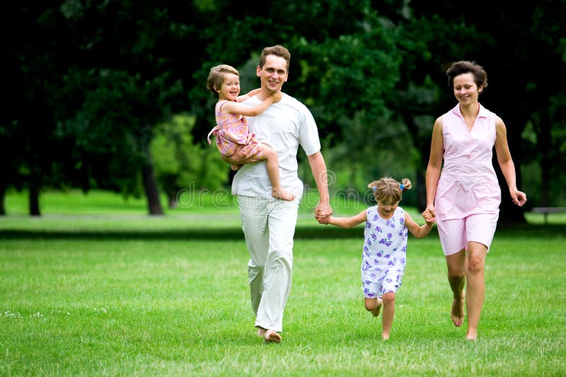 Family running in park stock photo. Image of lawn, group - 10448880