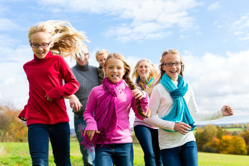 Family Running in the Meadow for Sport Stock Image - Image of sunlight ...