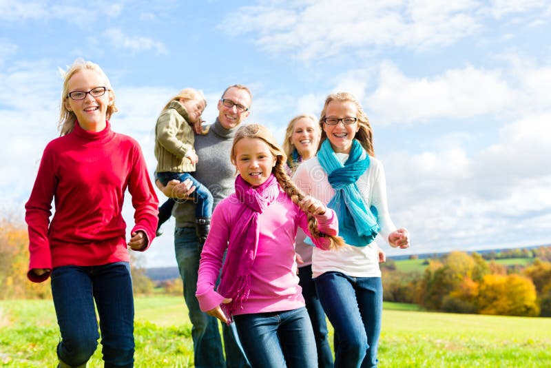 Family Running in the Meadow for Sport Stock Image - Image of sunlight ...