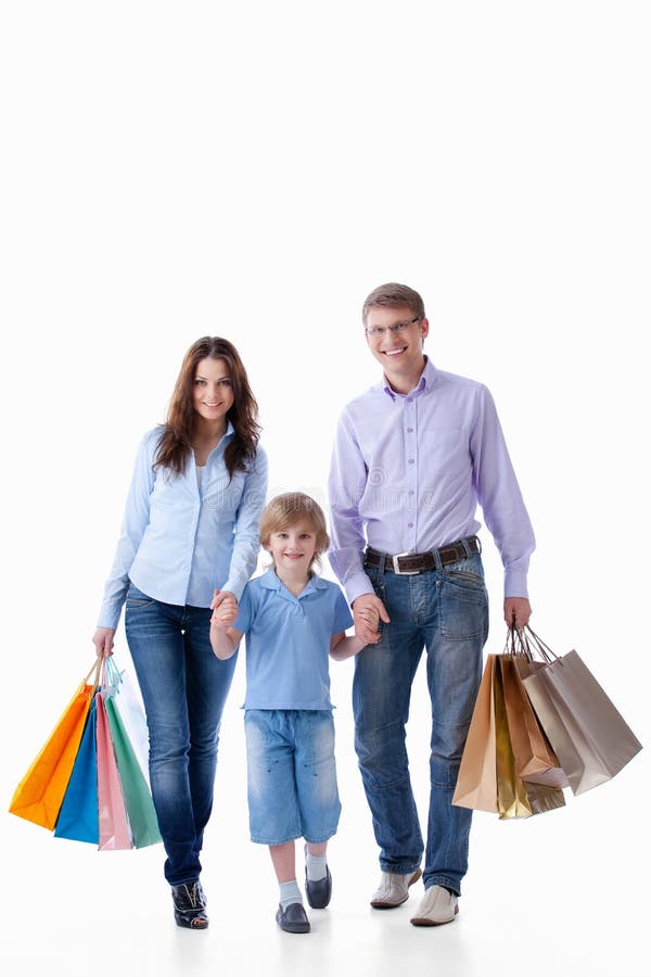 Loving Family Standing Looking at Camera in Shopping Mall Stock Image ...