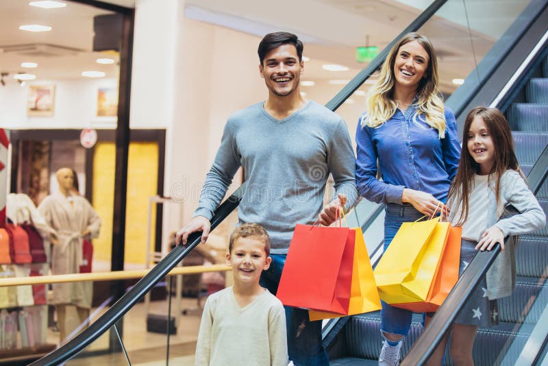 Family Shopping for Clothes and Looking Happy Stock Photo - Image of ...