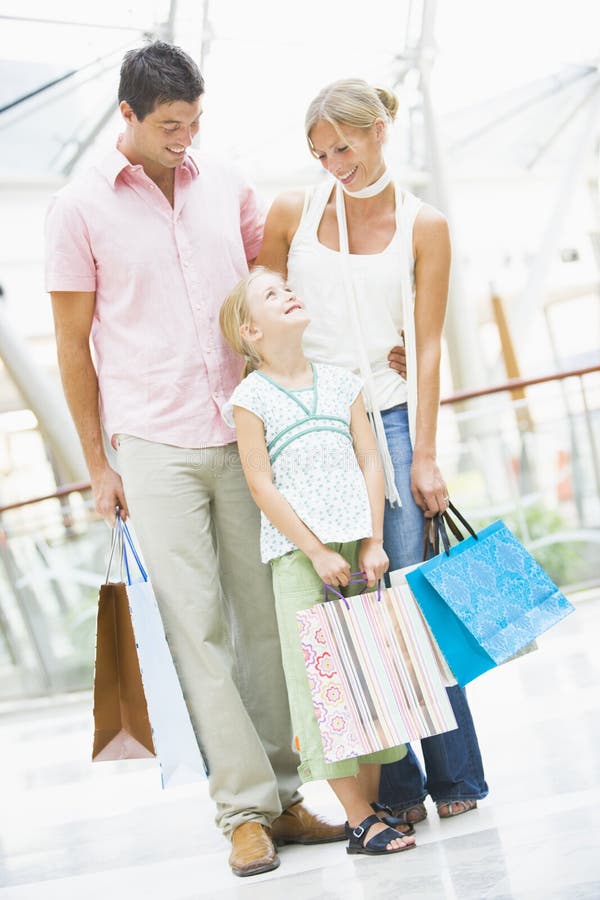 Family shopping in mall stock image. Image of carrying - 5092599