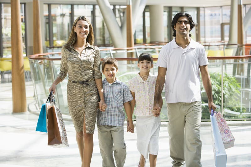 Family shopping in mall stock photo. Image of middle, four - 5210742