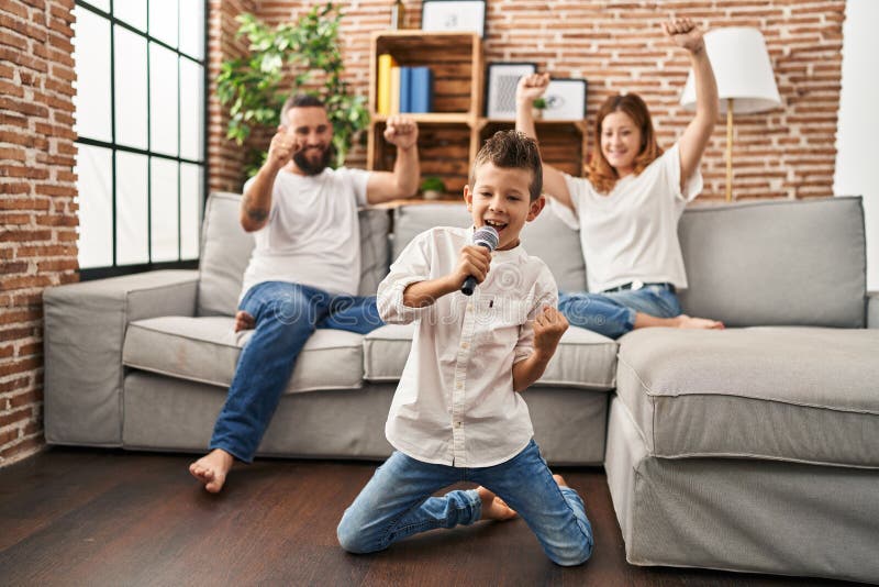 Family Singing Song Using Microphone at Home Stock Photo - Image of ...