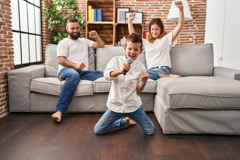 Family Singing Song Using Microphone at Home Stock Image - Image of ...