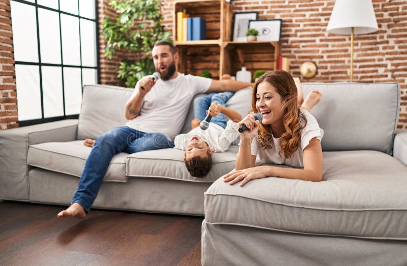 Family Singing Song Using Microphone at Home Stock Image - Image of ...