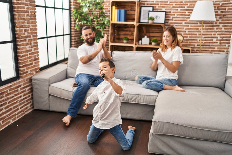 Family Singing Song Using Microphone at Home Stock Image - Image of ...