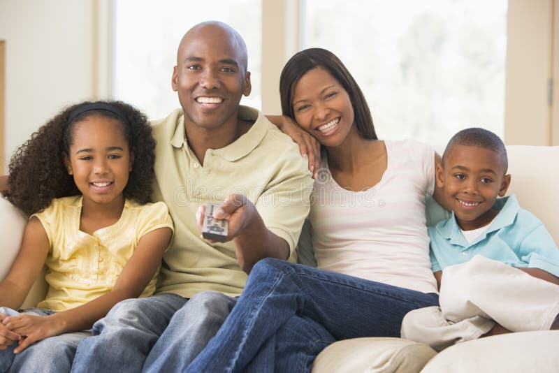 Family Sitting in Room with Remote Control Stock Image - Image of happy ...