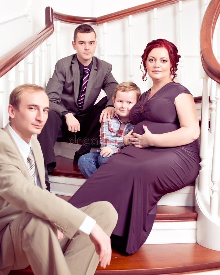 Family Sitting on Staircase Smiling Stock Photo - Image of horizontal ...