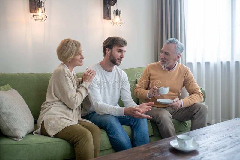 Family Sitting Together and Talking Stock Image - Image of relations ...