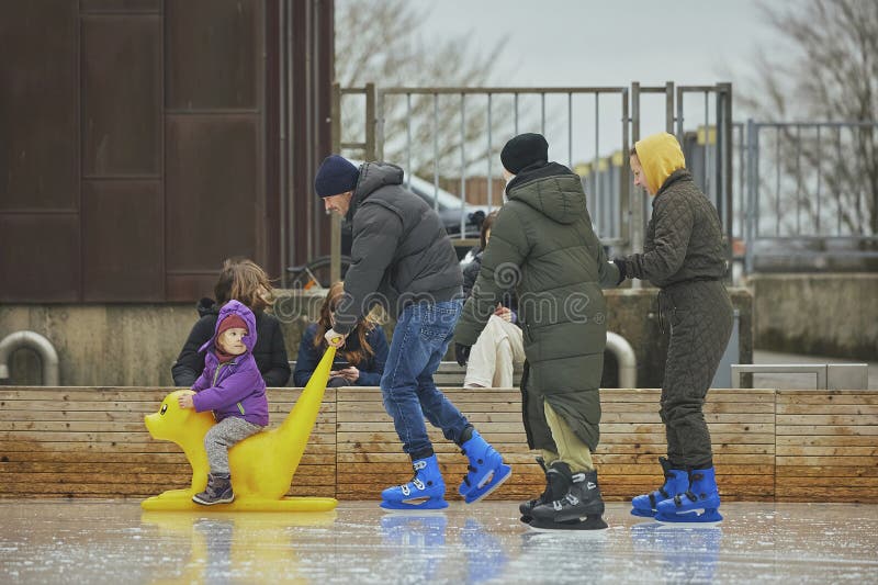 Family Skating on an Ice Skating Rink in Denmark in the Evening Stock ...