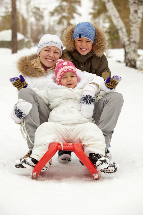 Family on sledge stock photo. Image of parenthood, husband - 35197924