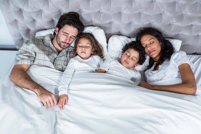Family sleeping together stock photo. Image of female - 62325888