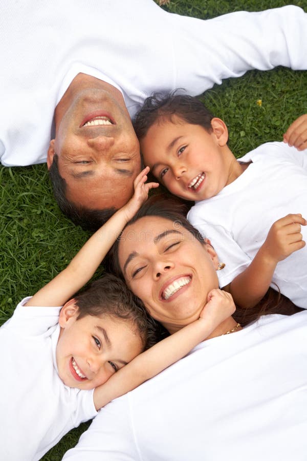 Family smiling stock image. Image of happy, cheerful, grass - 4597443