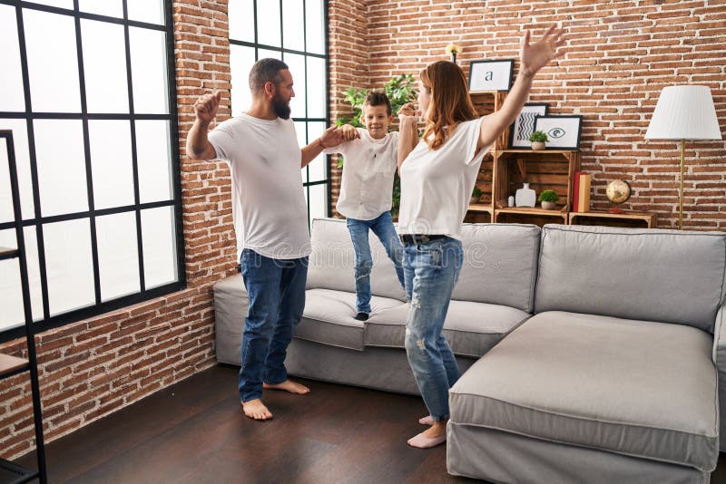 Family Smiling Confident Dancing at Home Stock Image - Image of ...