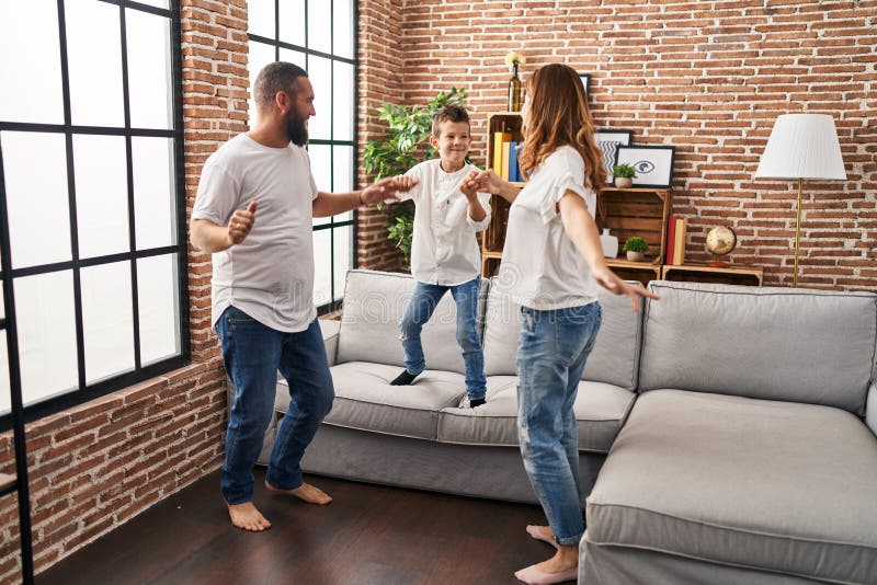 Family Smiling Confident Dancing at Home Stock Photo - Image of ...