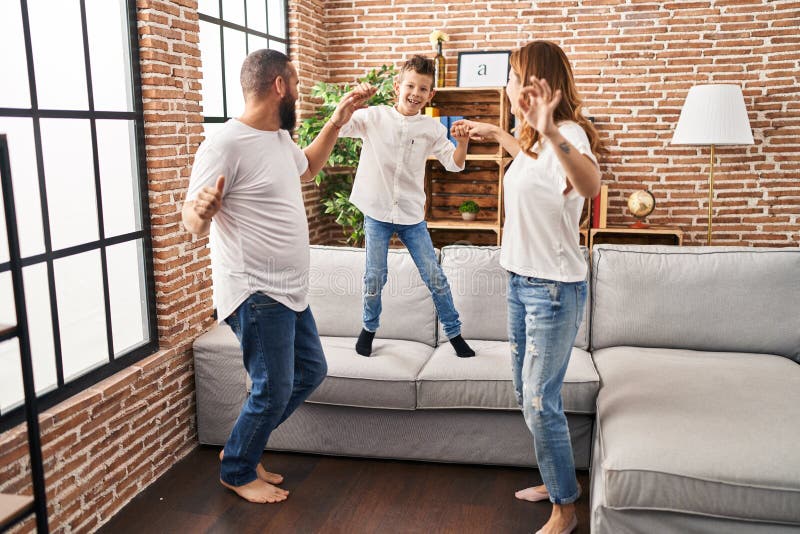Family Smiling Confident Dancing at Home Stock Image - Image of sofa ...