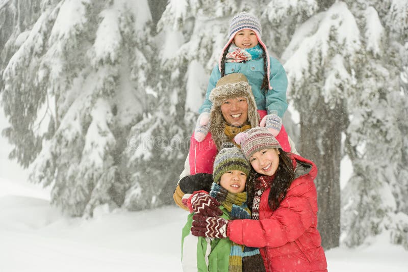 Family in the snow stock photo. Image of affection, outdoor - 62806470