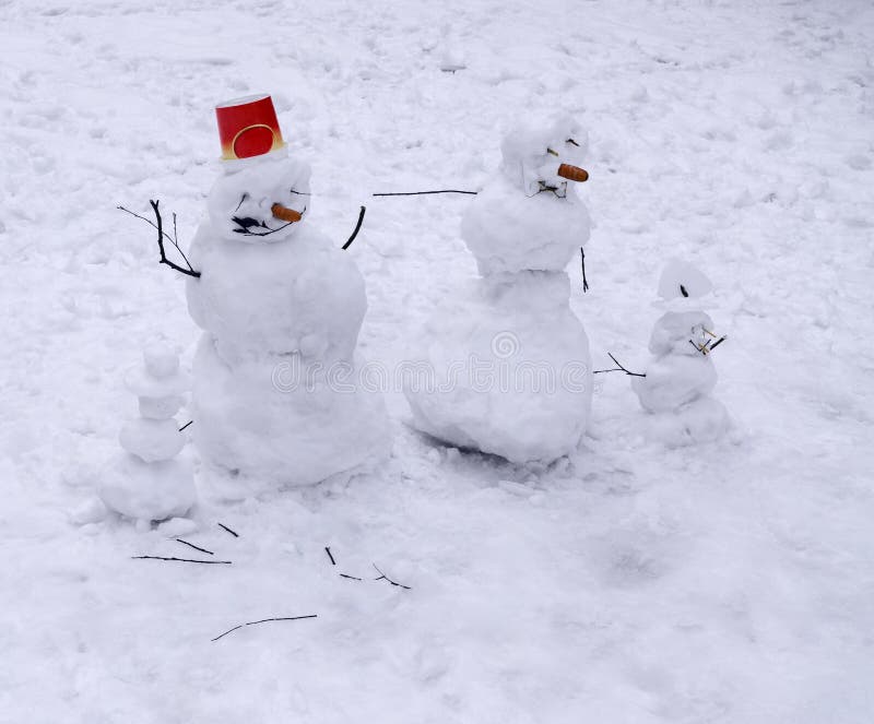 Family Snowmen of Four Figures Stock Image - Image of coniferous ...
