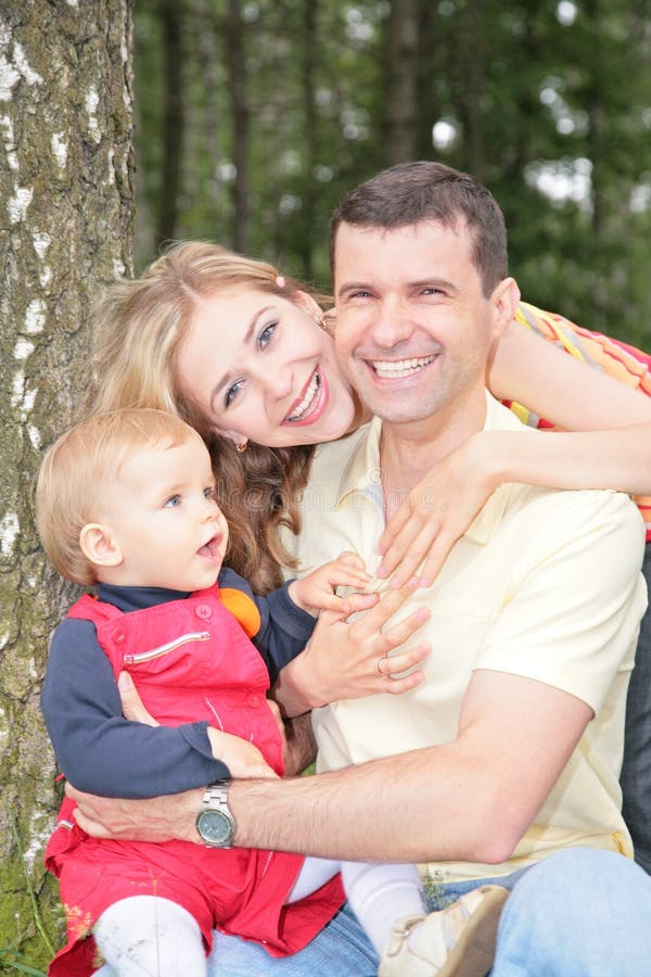 Family with son in park stock photo. Image of family, happy - 5564928