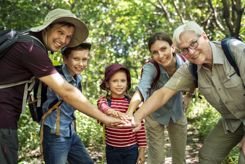 Family Stacking Hands As a Team Stock Photo - Image of forest, people ...