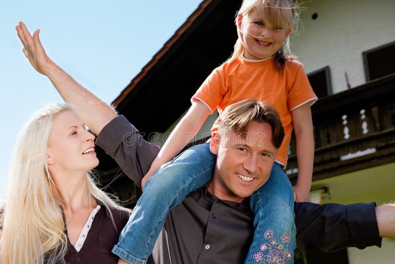 Family Standing in Front of Their Home Stock Image - Image of people ...