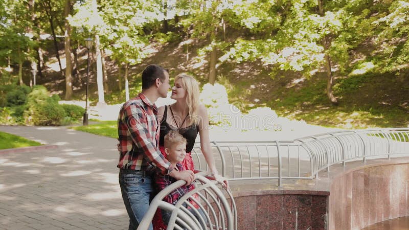 Family Stands by the Lake in the Park. Stock Footage - Video of child ...