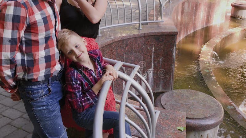 Family Stands by the Lake in the Park. Stock Footage - Video of girl ...