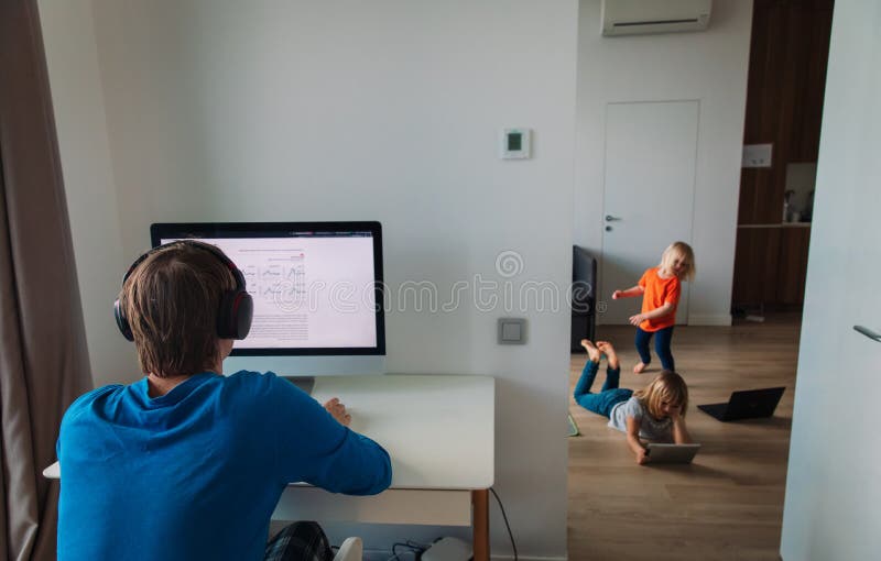Family Stay Home, Father Work on Computer while Kids Dance and Look at ...