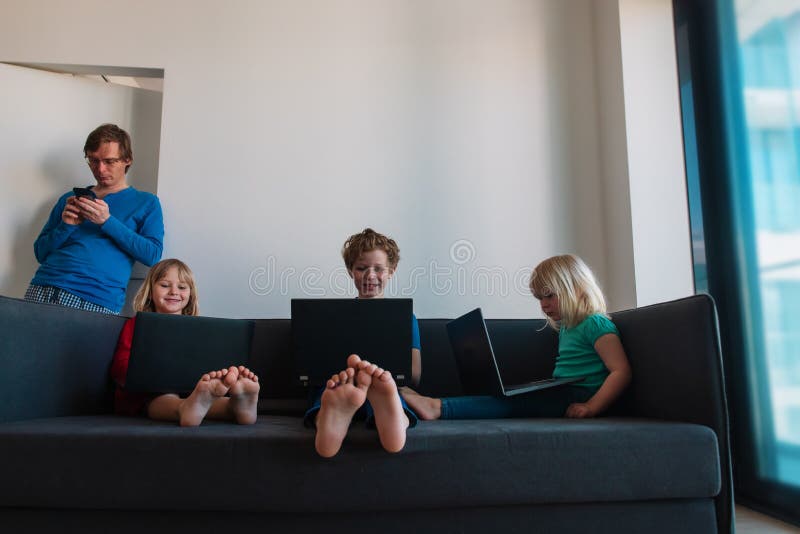 Family Staying Home, Father Working Remotely while Kids on Distant ...